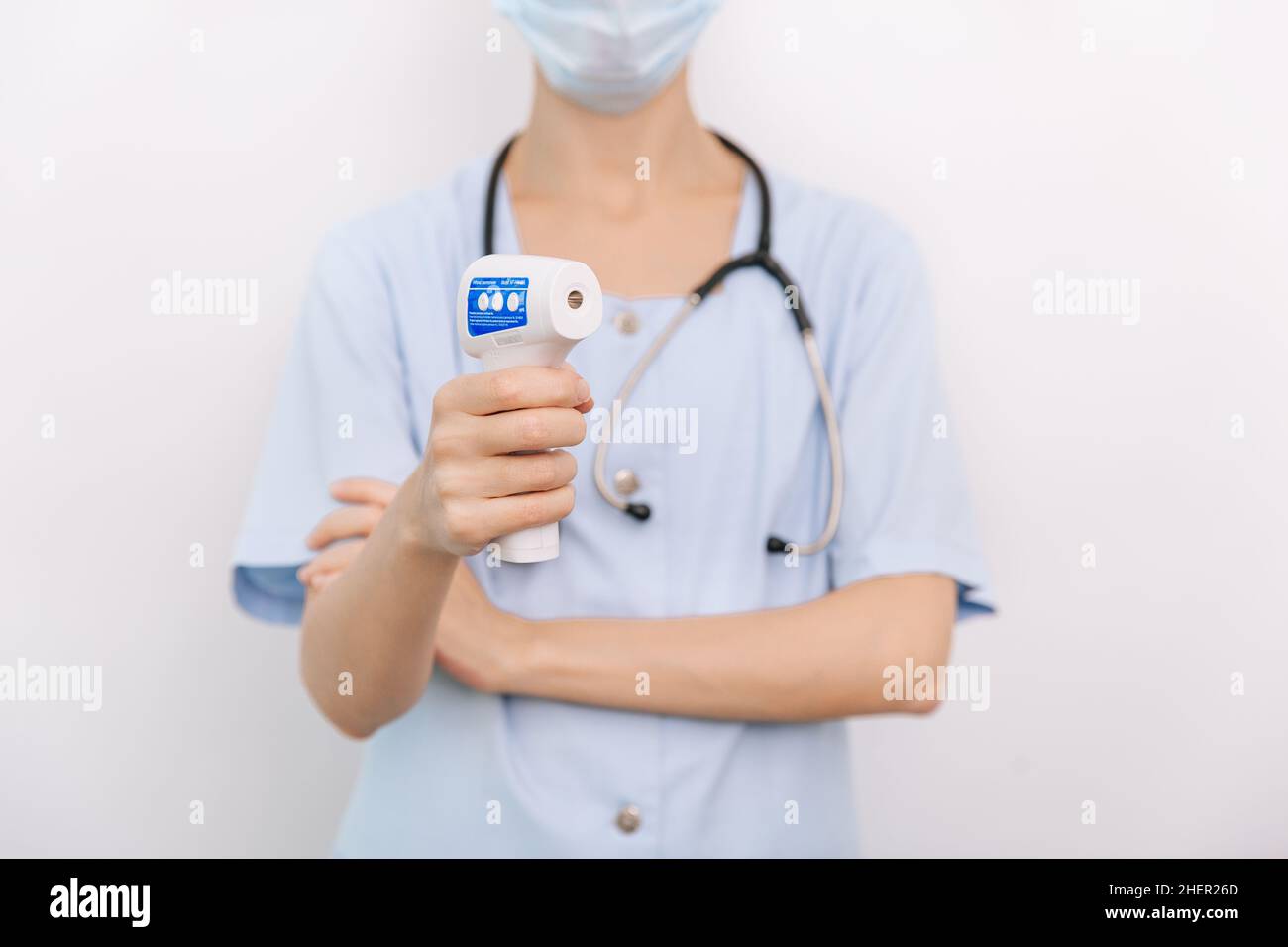 Temperature measurement gun in doctor hands. Close-up shot of doctor ...