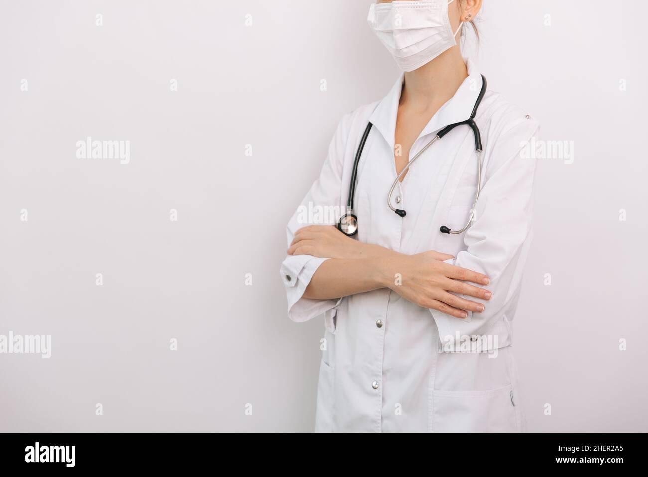 Doctor with stethoscope in medical coat on white background. Front ...