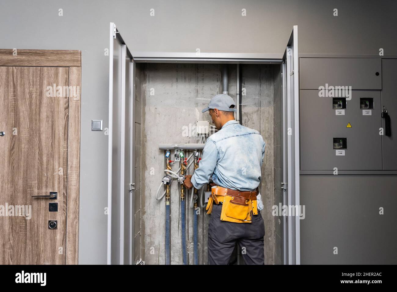 Plumber Repairing Water Pipes In Residential Building Stock Photo - Alamy