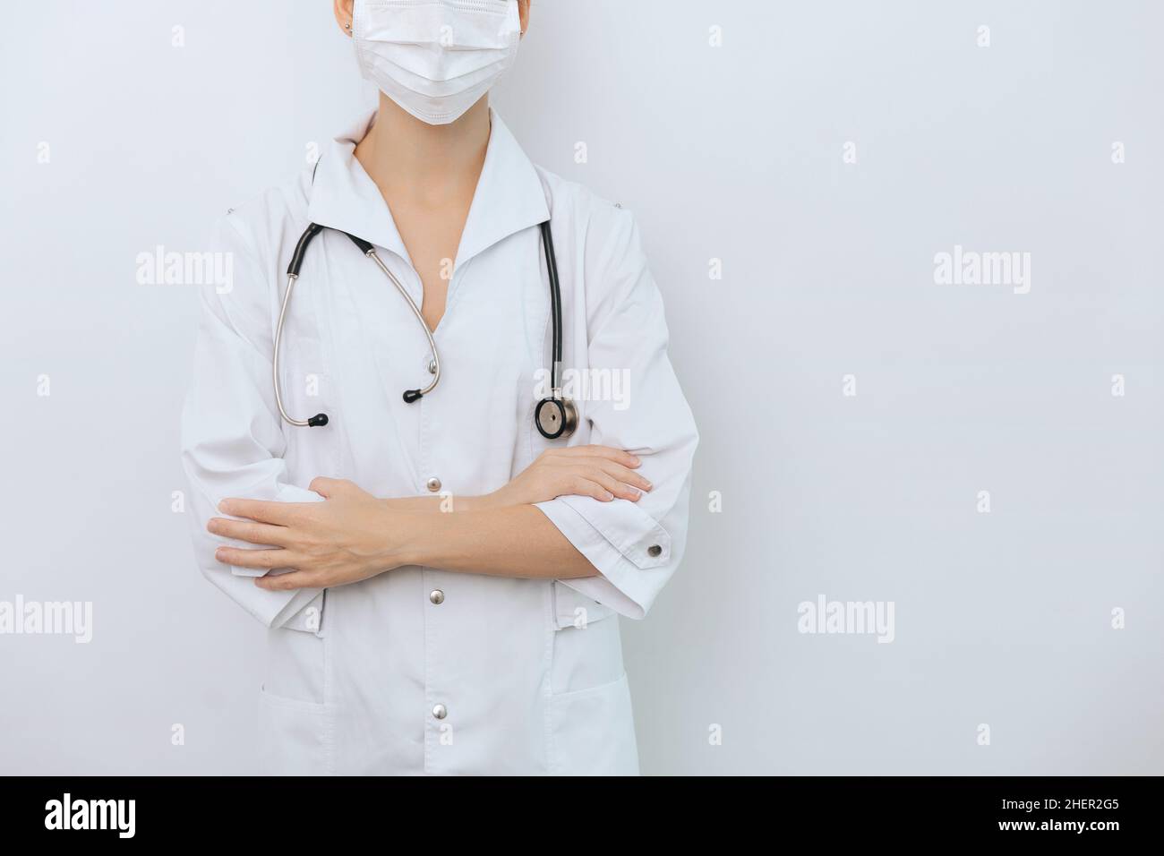 Doctor with stethoscope in medical coat on white background. Front ...