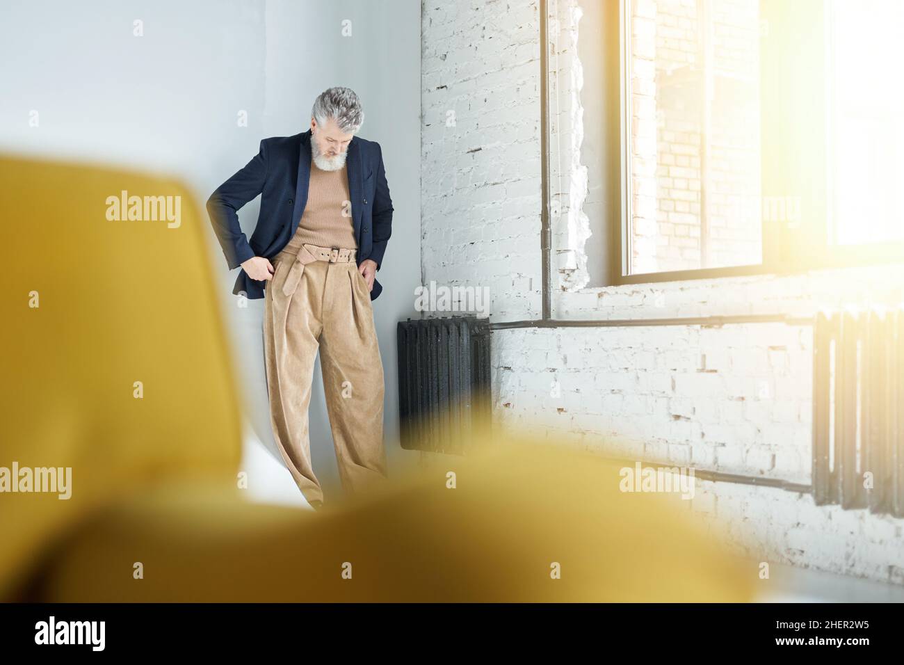 Full length shot of stylish middle aged man in business casual wear ...