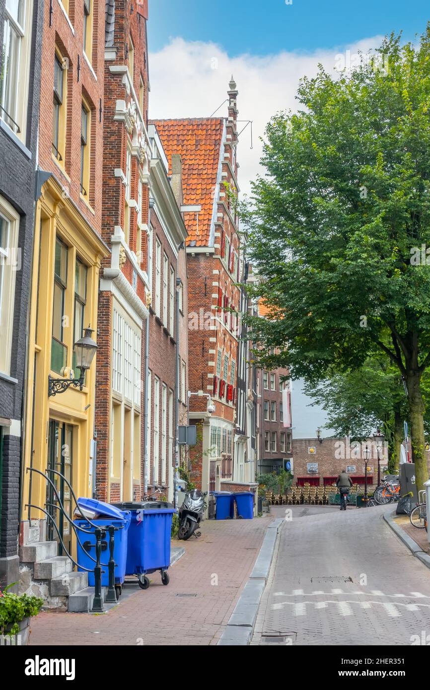 Netherlands. Summer street of Amsterdam. Typical house with a sloping ...
