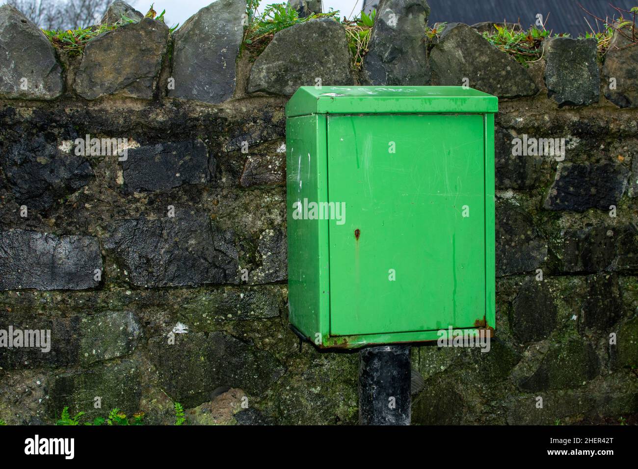 Green mounting box, suspended on the outer fence Stock Photo - Alamy