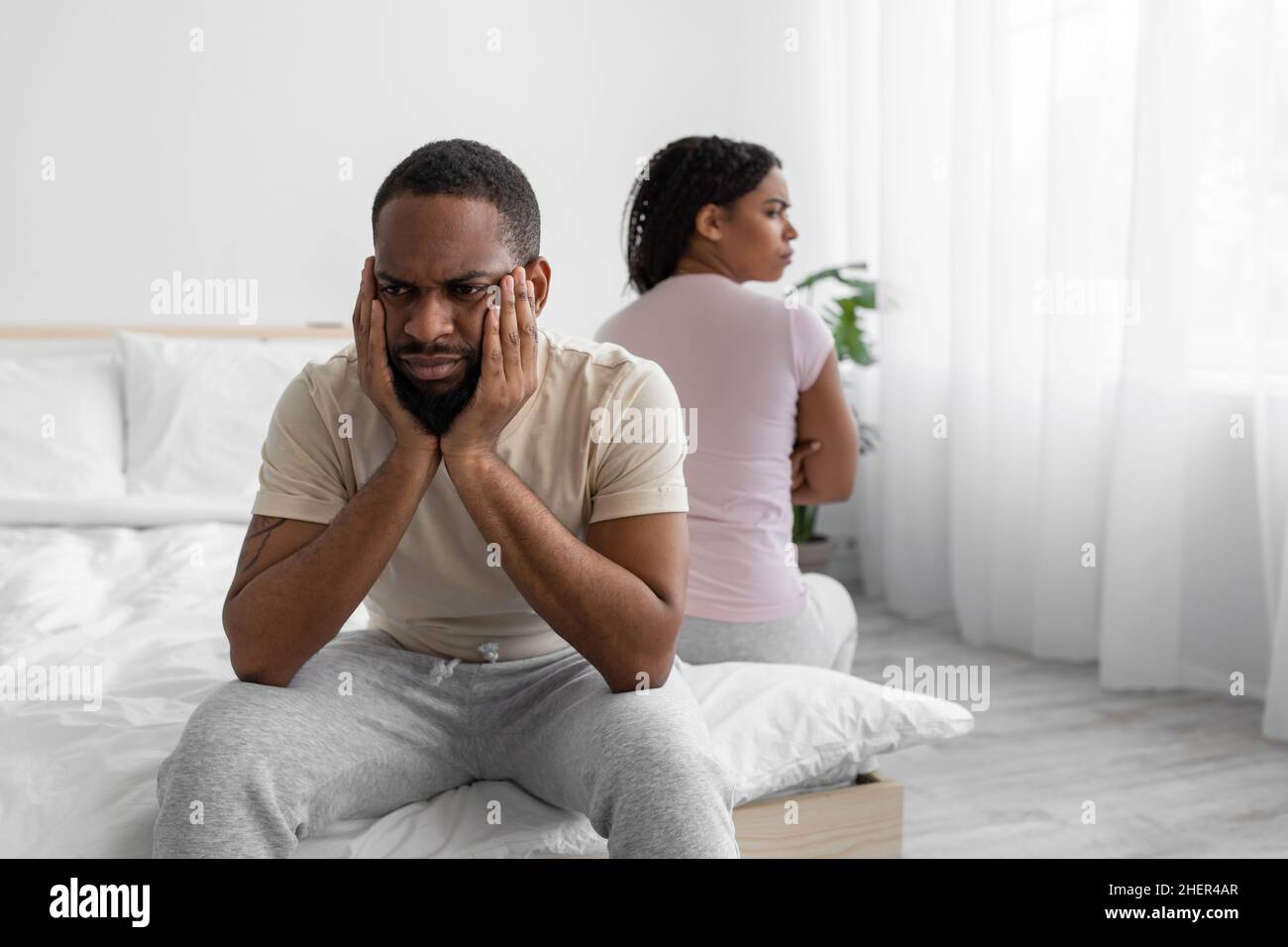 Unhappy offended young african american husband ignores wife, sit on ...