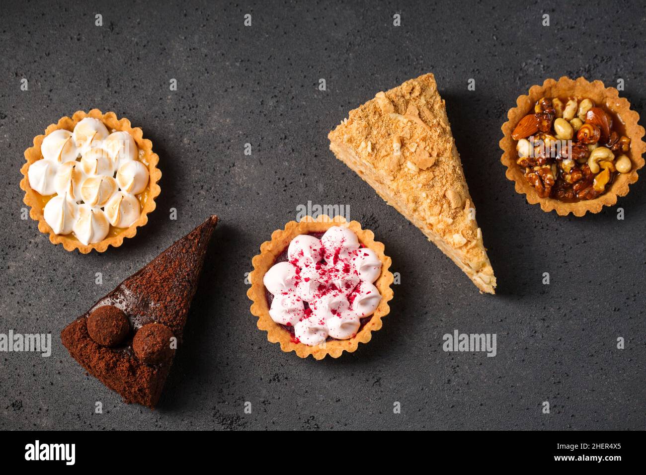 Collection of delicious desserts on gray background, top view Stock ...