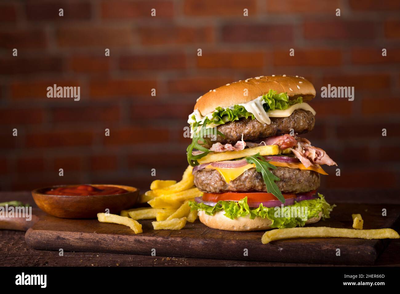 Fresh delicious double burger with meatball, cheese, tomato, onion ...