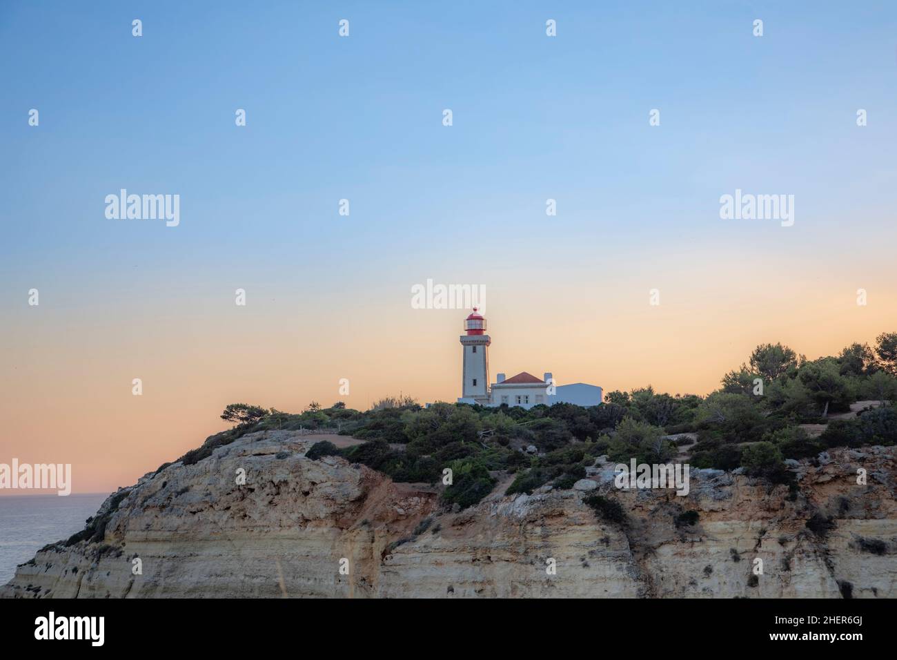 famous lighthouse at the Algarve coast in Carvoeiro, Portugal Stock ...
