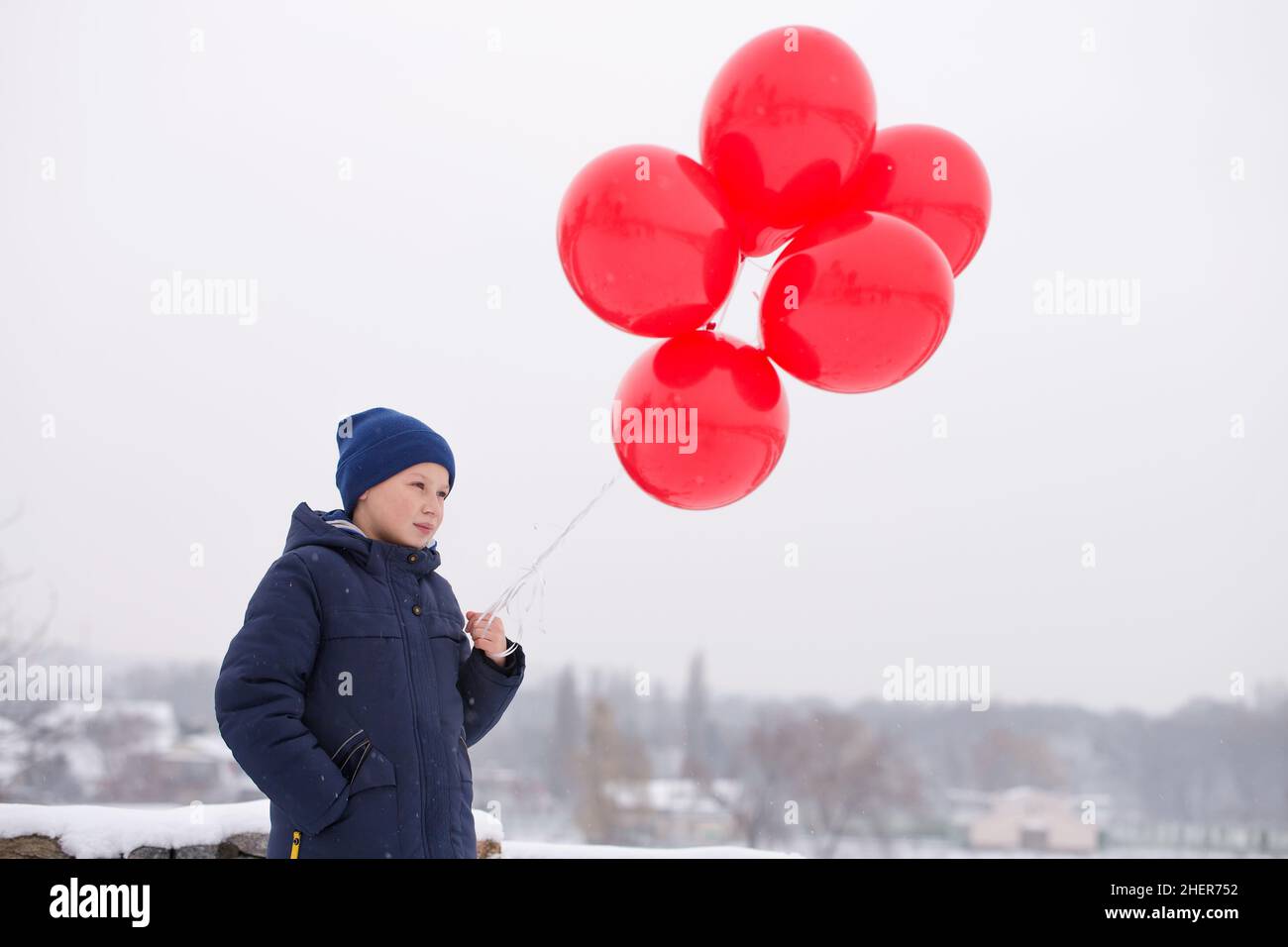 Hand holding red balloon outdoors hi-res stock photography and images ...