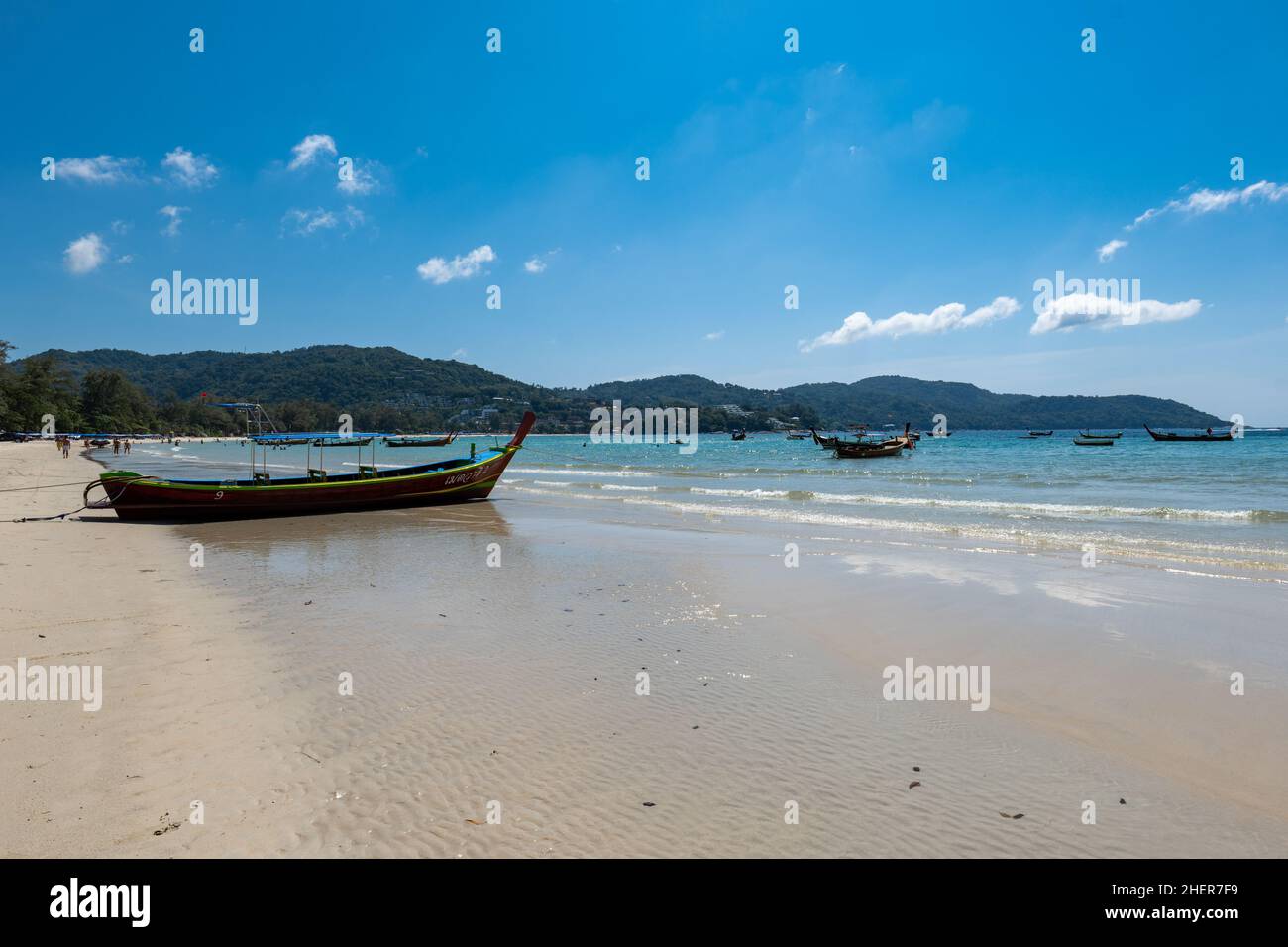 Beach with clear water with white and golden sand, blue sky, in ...