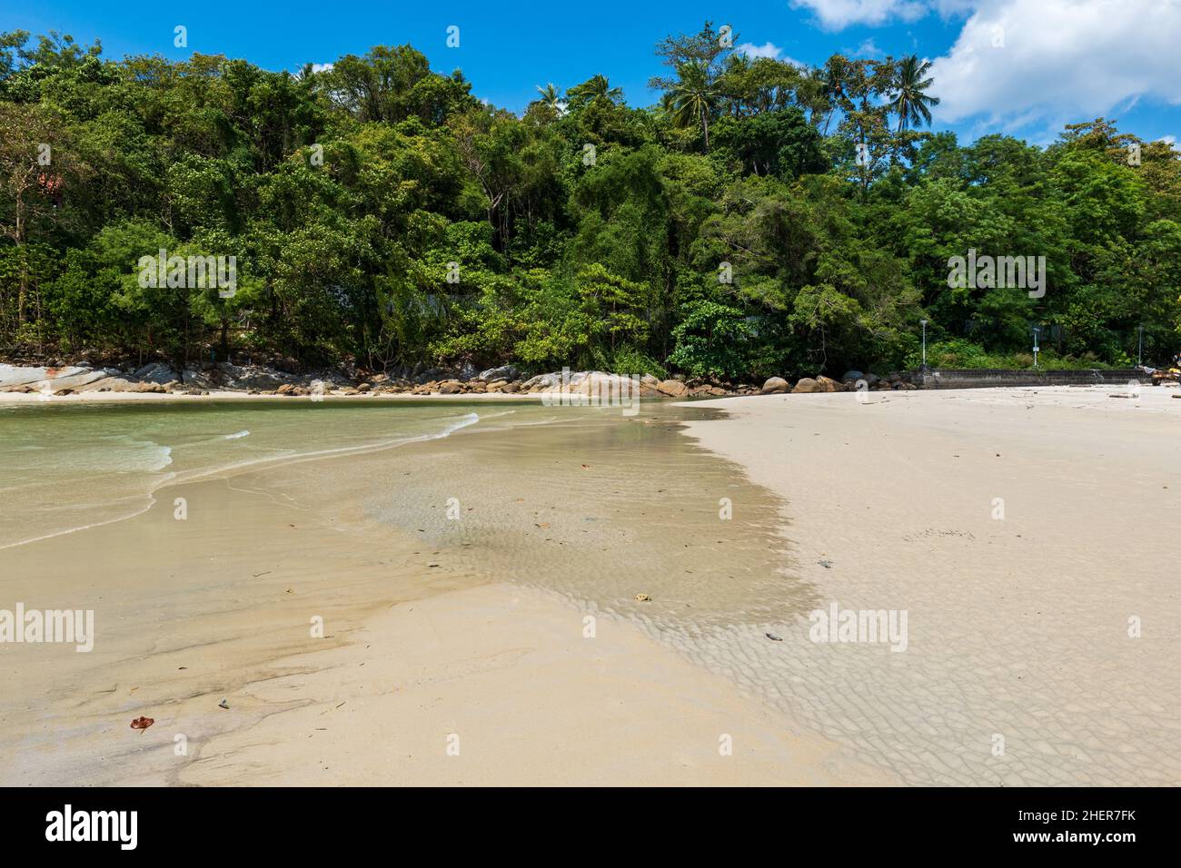 Beach with clear water with white and golden sand, blue sky, in ...