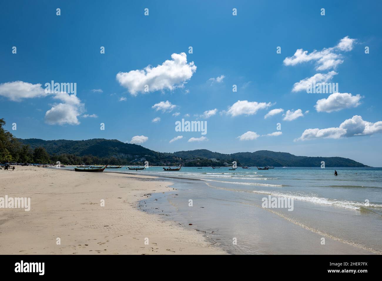 Beach with clear water with white and golden sand, blue sky, in ...