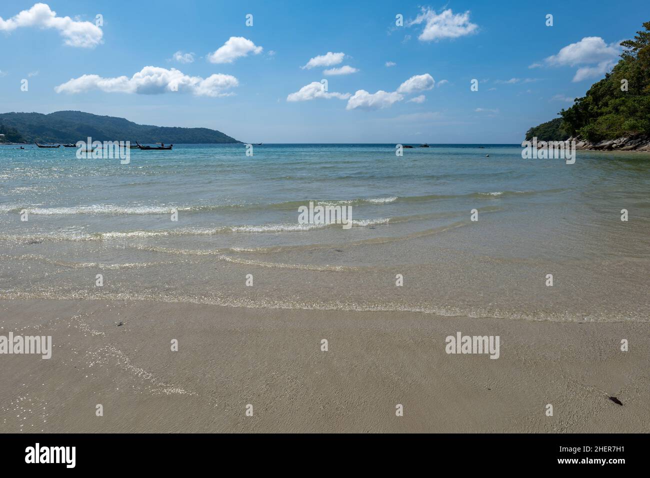 Beach with clear water with white and golden sand, blue sky, in ...