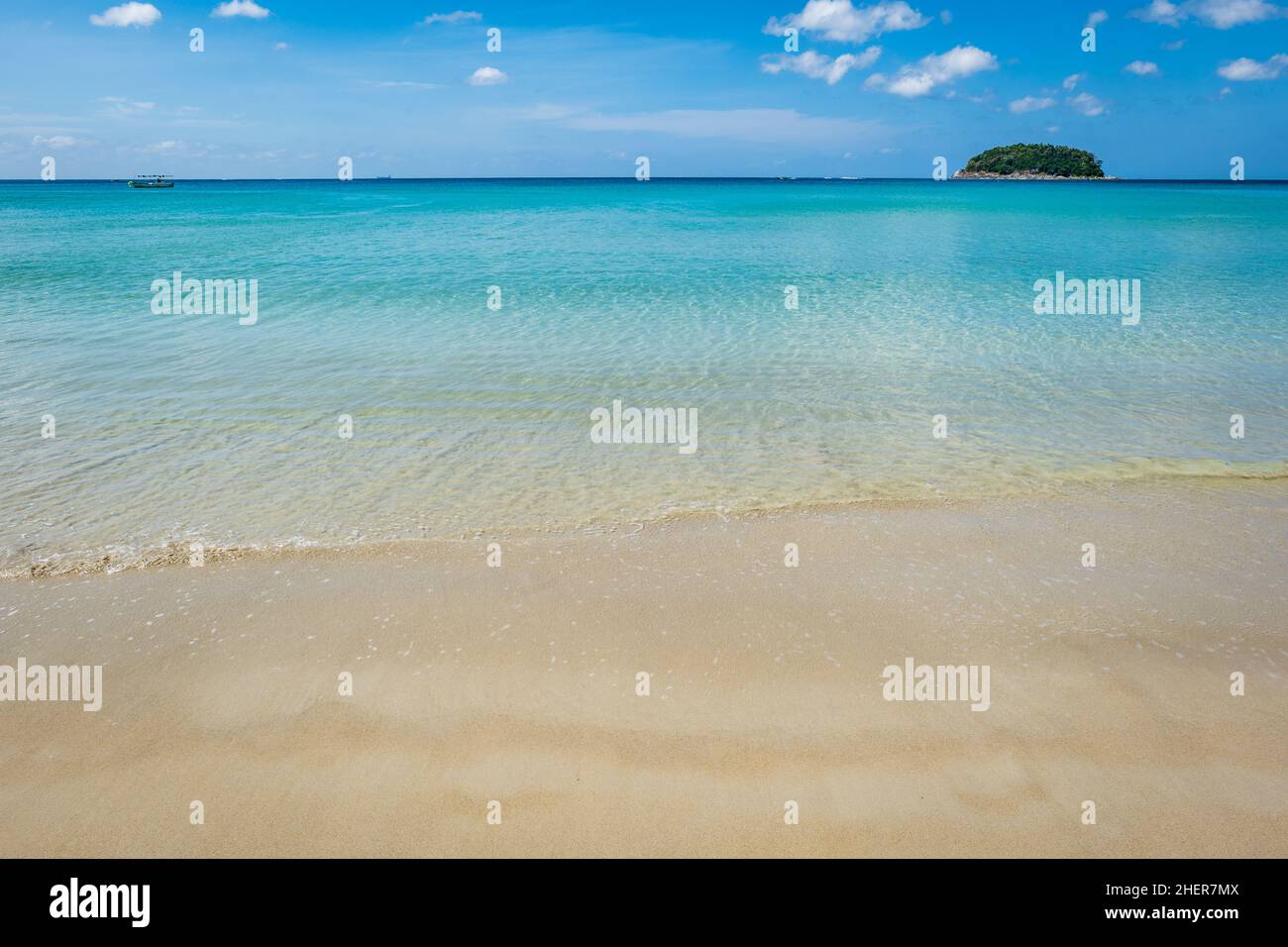 Beach with clear water with white and golden sand, blue sky, in ...