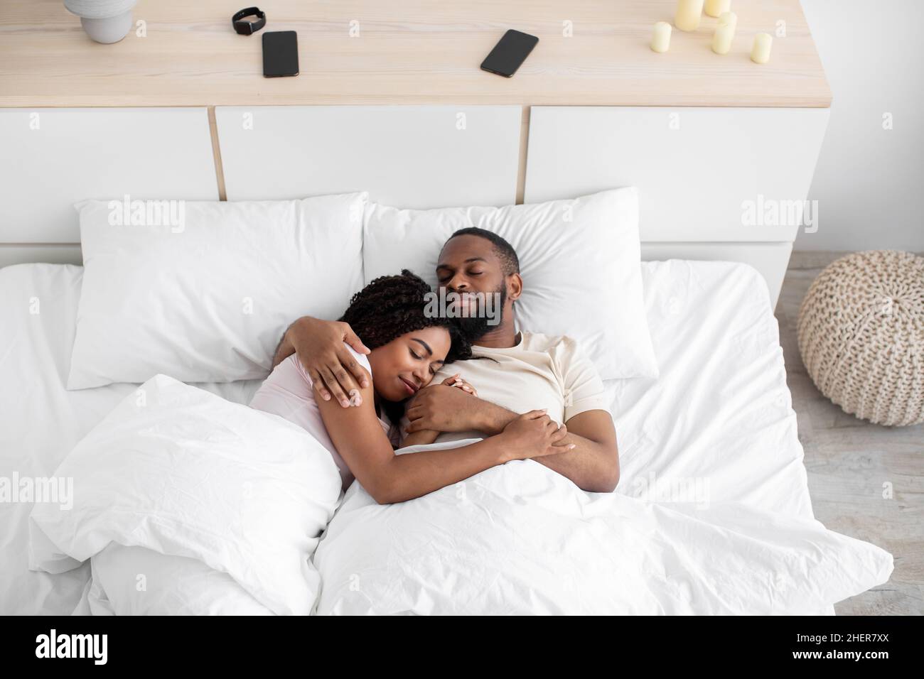 Man And Woman Cuddling In Bed