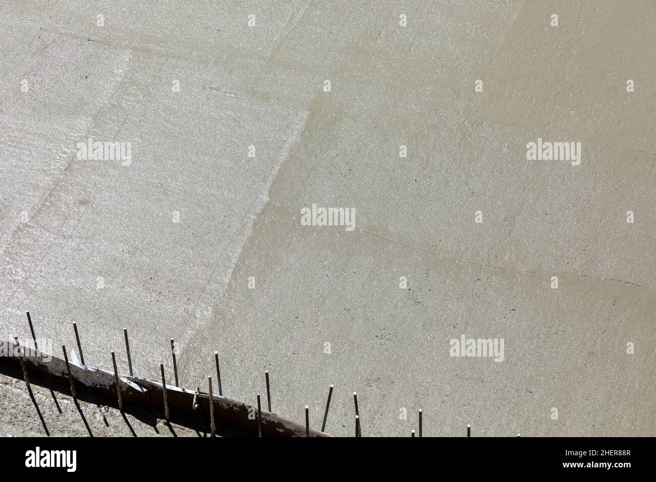 detail of iron rod at a concrete foundation with wet cement Stock Photo ...