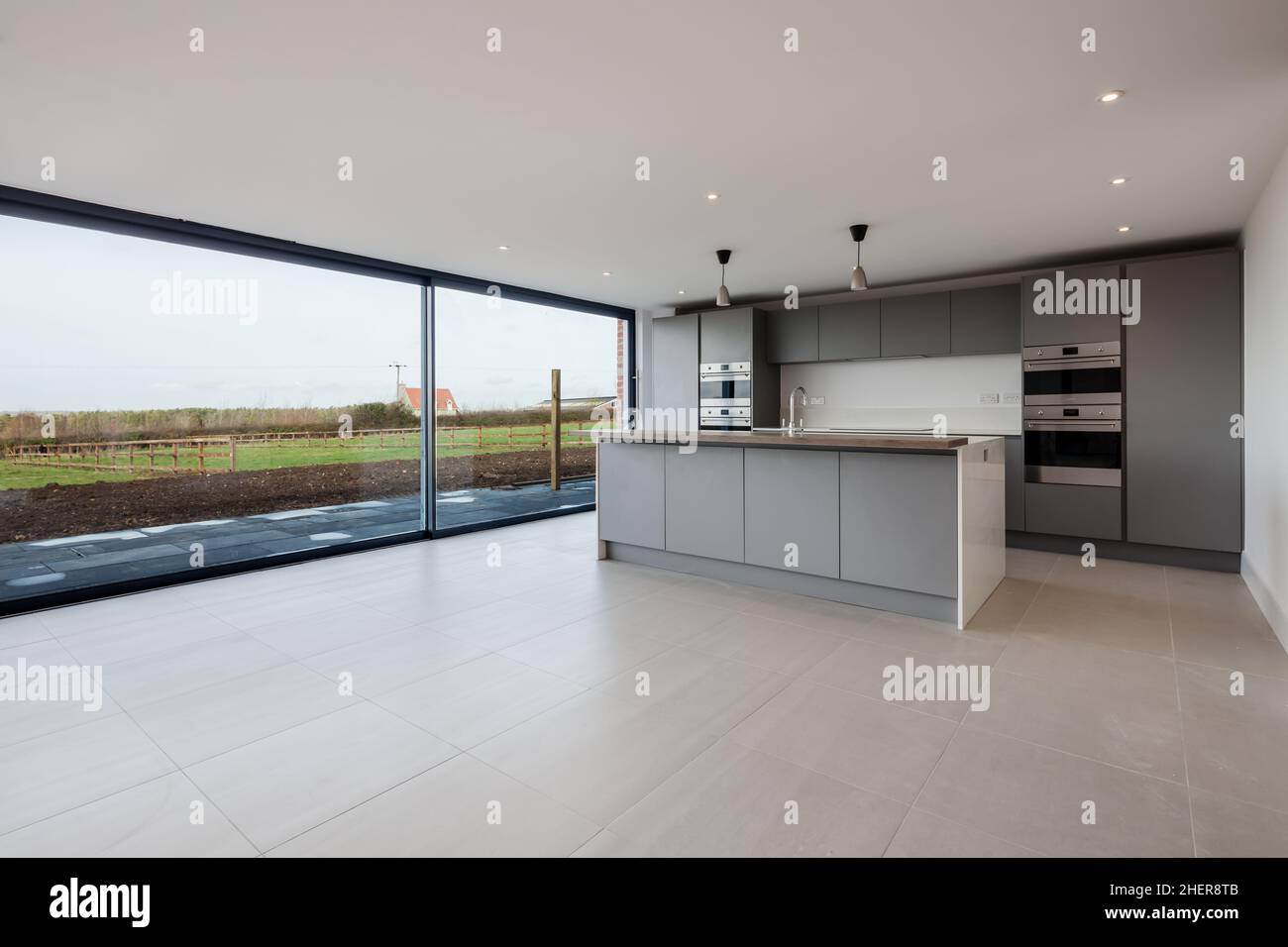 Hob and oven in kitchen island hi-res stock photography and images - Alamy