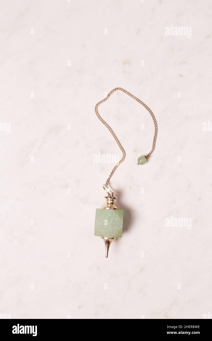 pendulum made of natural stone for work in a stream reiki Stock Photo ...