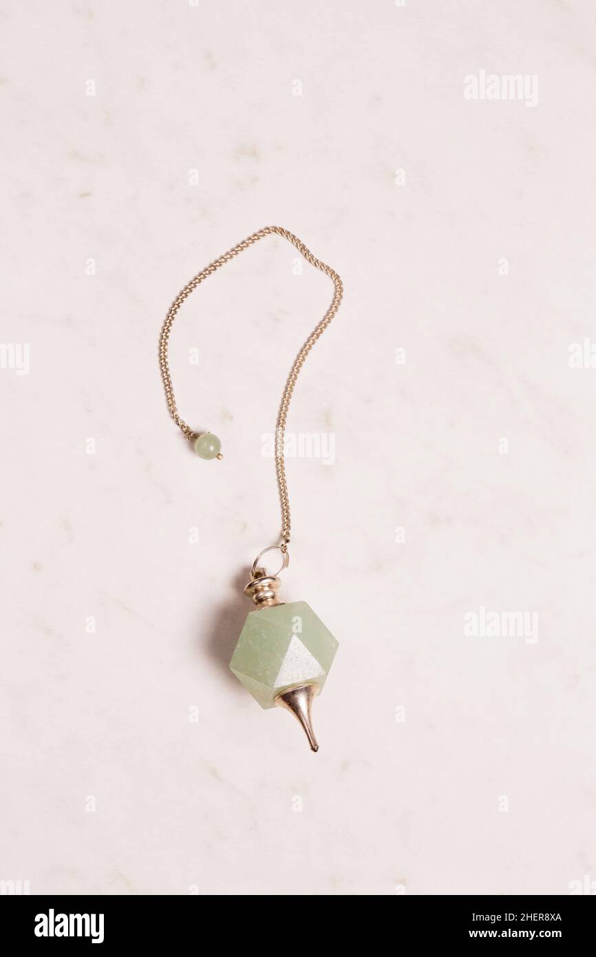 pendulum made of natural stone for work in a stream reiki Stock Photo ...
