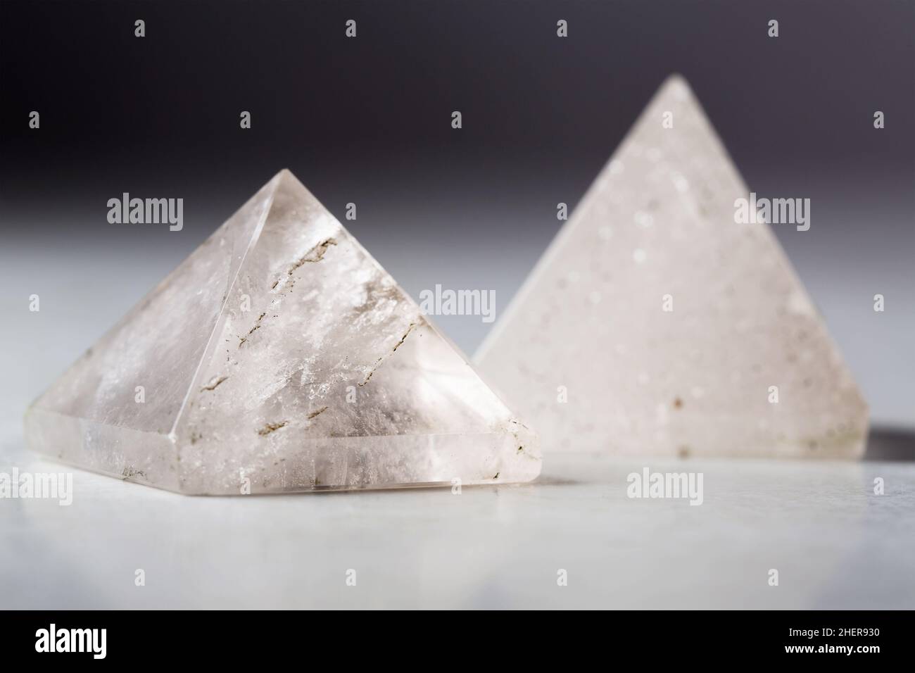 Natural rock crystal pyramid against a dark background, Reiki concept ...