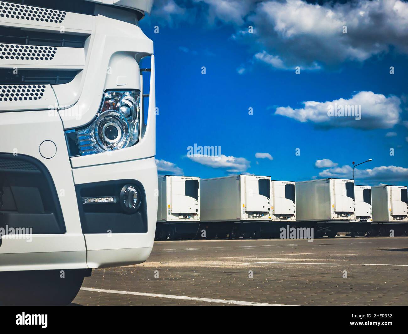 White lorry trailers standing in the lin Stock Photo - Alamy