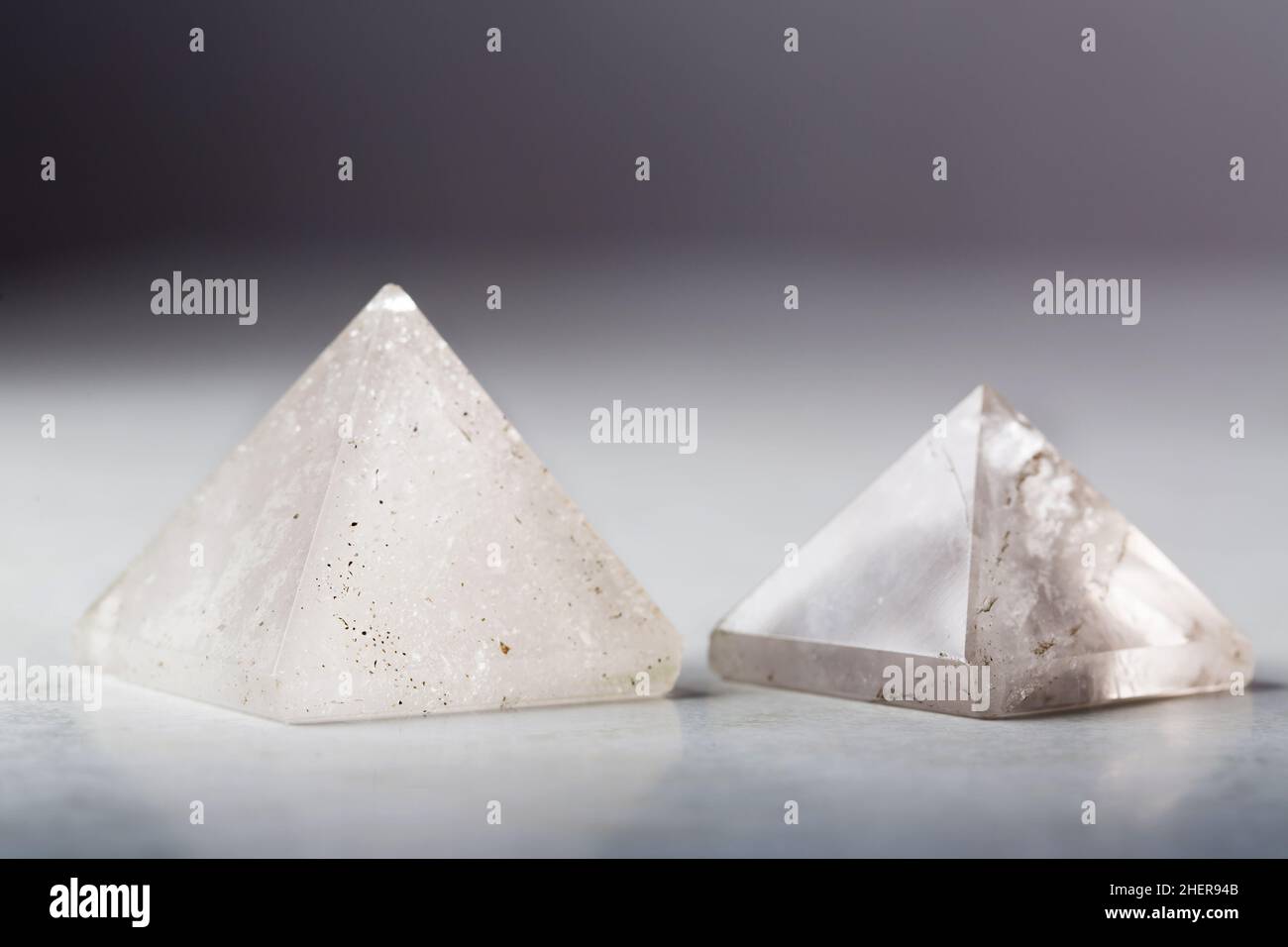 Natural rock crystal pyramid against a dark background, Reiki concept ...