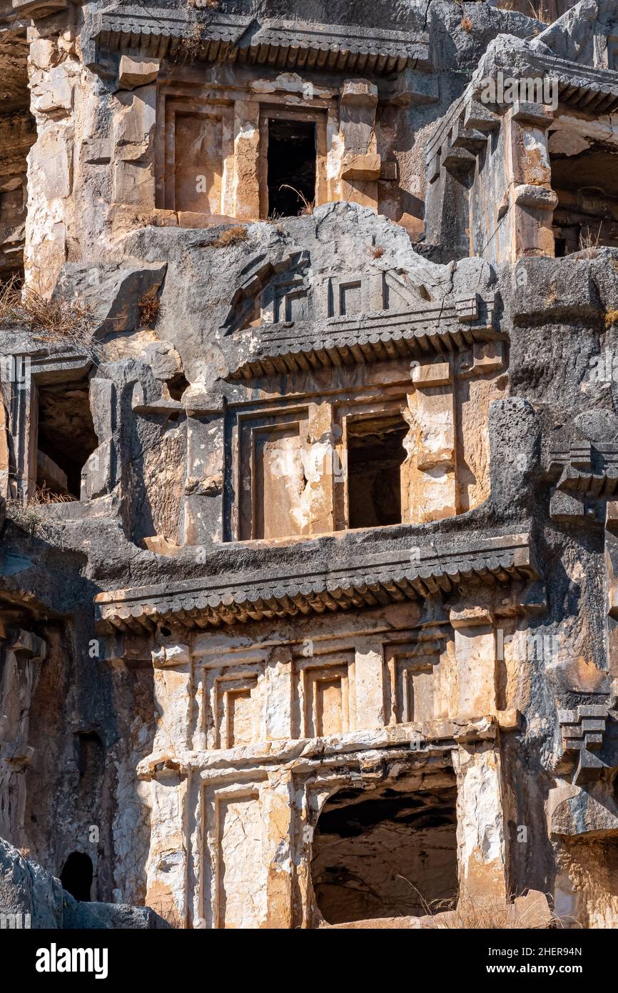 ruins of a rocky necropolis with stone-cut tombs in Myra Lycian Stock ...
