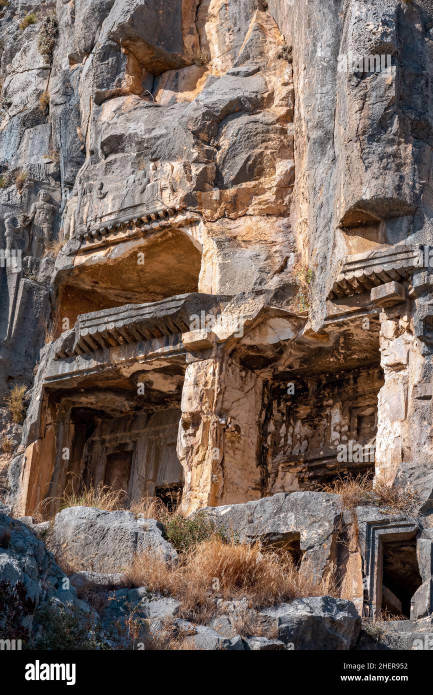 ruins of a rocky necropolis with stone-cut tombs in Myra Lycian Stock ...