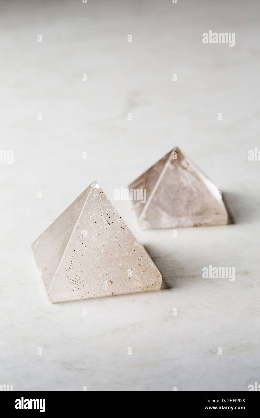 Natural rock crystal pyramid against a dark background, Reiki concept ...