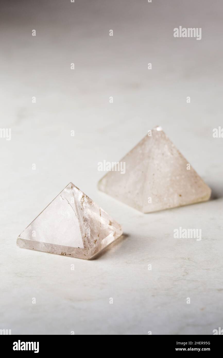 Natural rock crystal pyramid against a dark background, Reiki concept ...