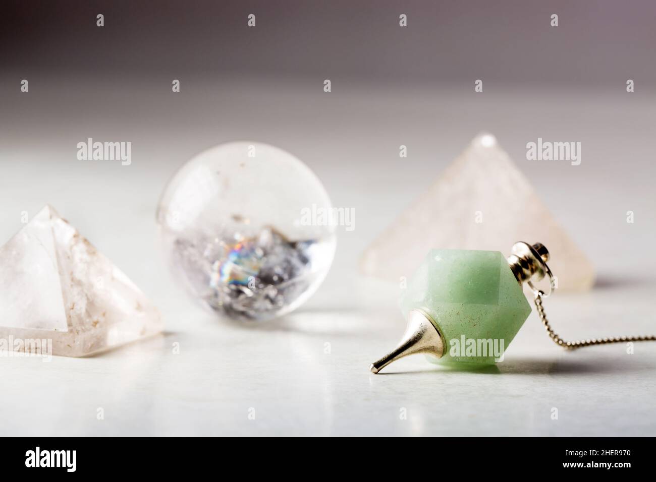 crystal ball, rock crystal pyramid and Pendulum, Reiki concept Stock ...