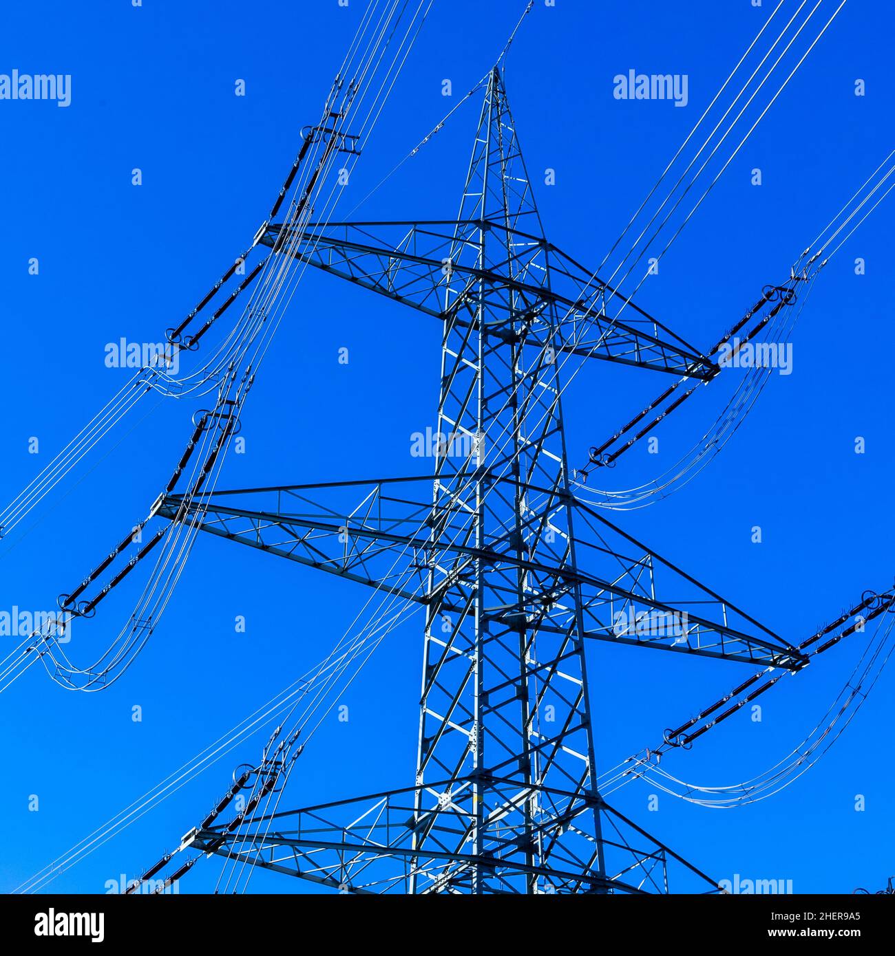 electric pylon under clear blue sky to transport electricity Stock ...