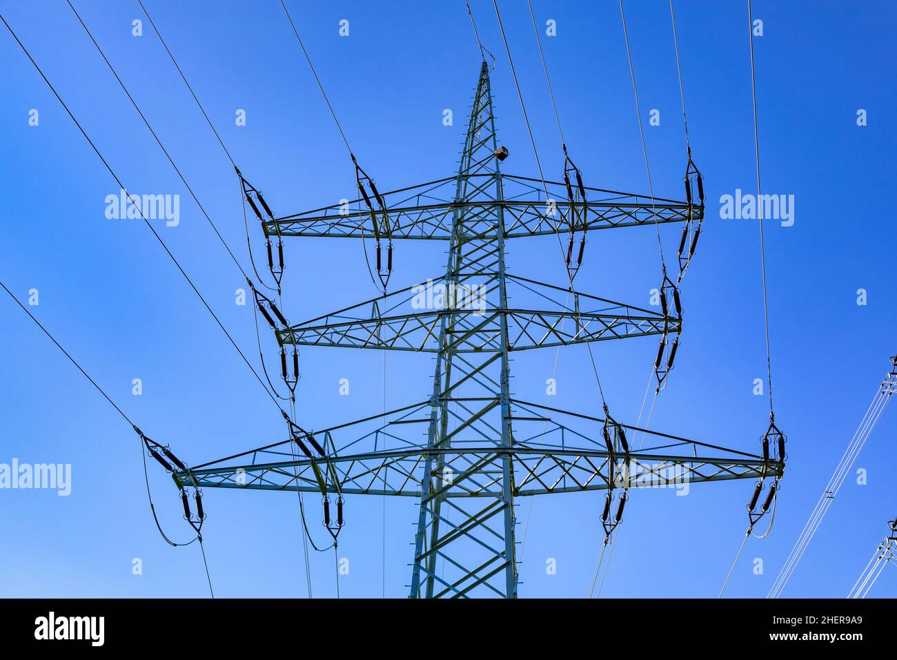 electric pylon under clear blue sky to transport electricity Stock ...