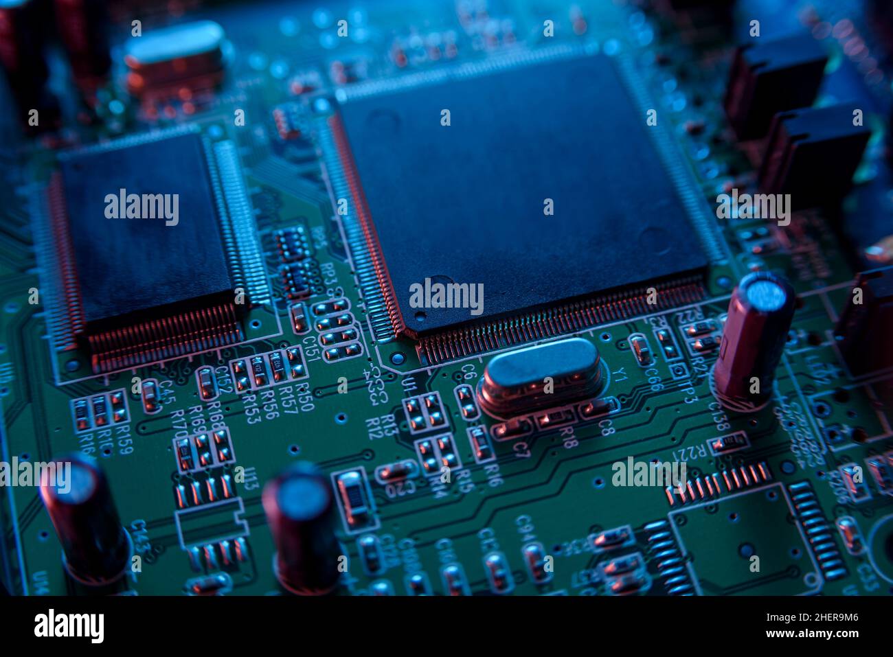 Microcircuit with chip close up with neon lighting. Chip shortage Stock ...