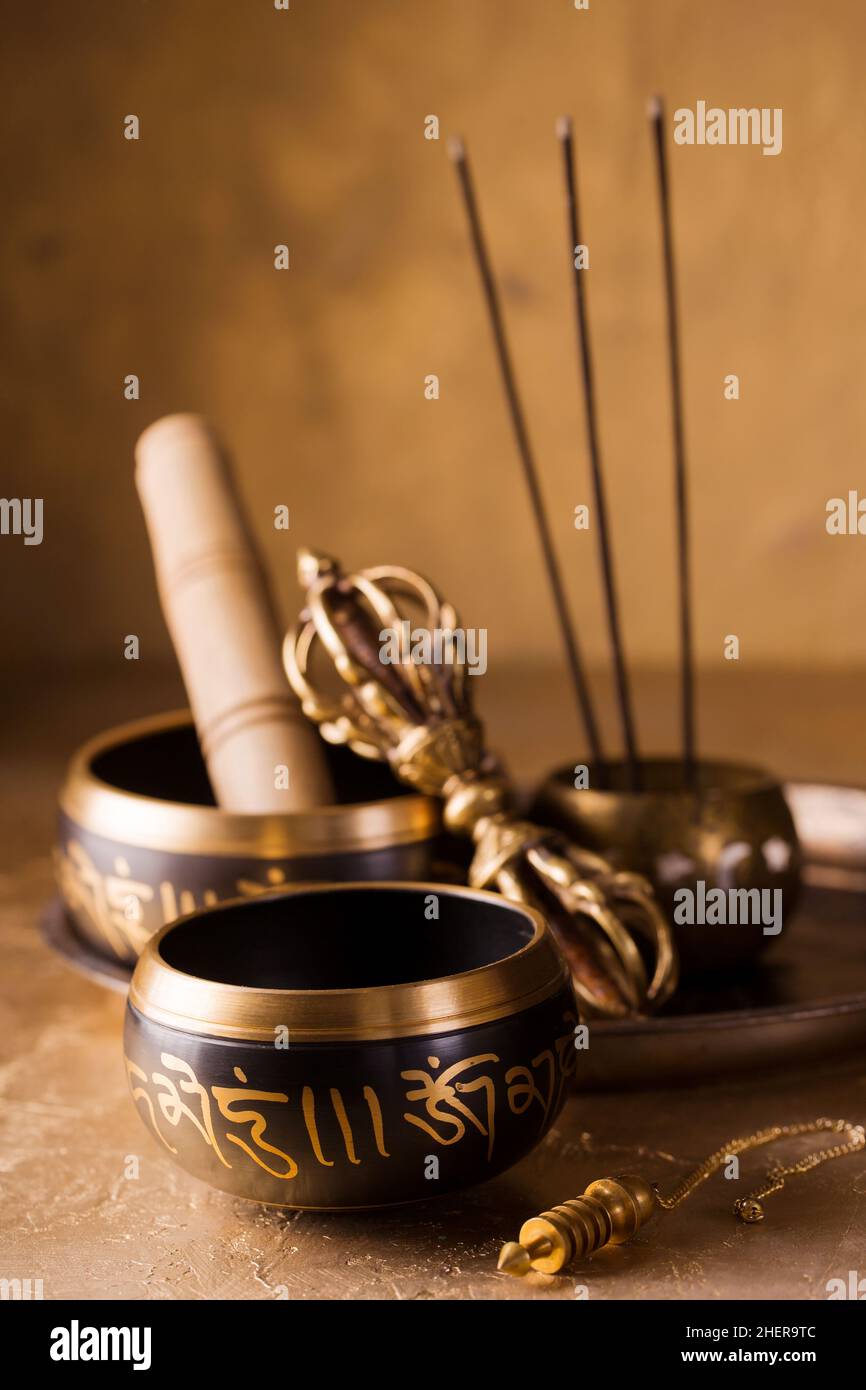 singing bowls, vajra and pendulum for healing in reiki flow Stock Photo ...