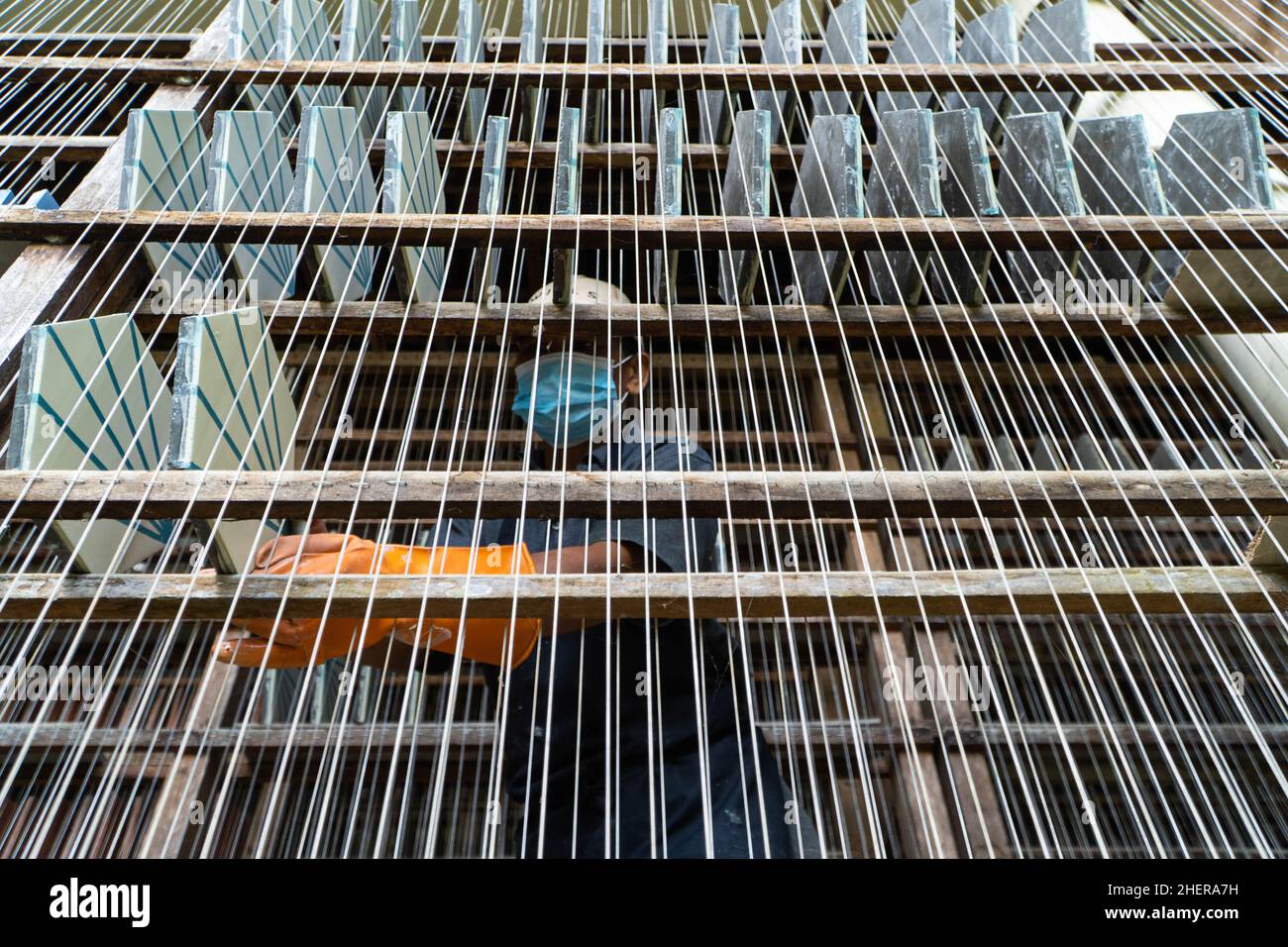 SIDEMEN/BALI-SEPT 03 2021: A tile factory worker in Sidemen village ...