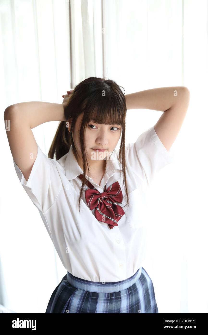 Portrait japanese school girl uniform in white tone bed room Stock ...