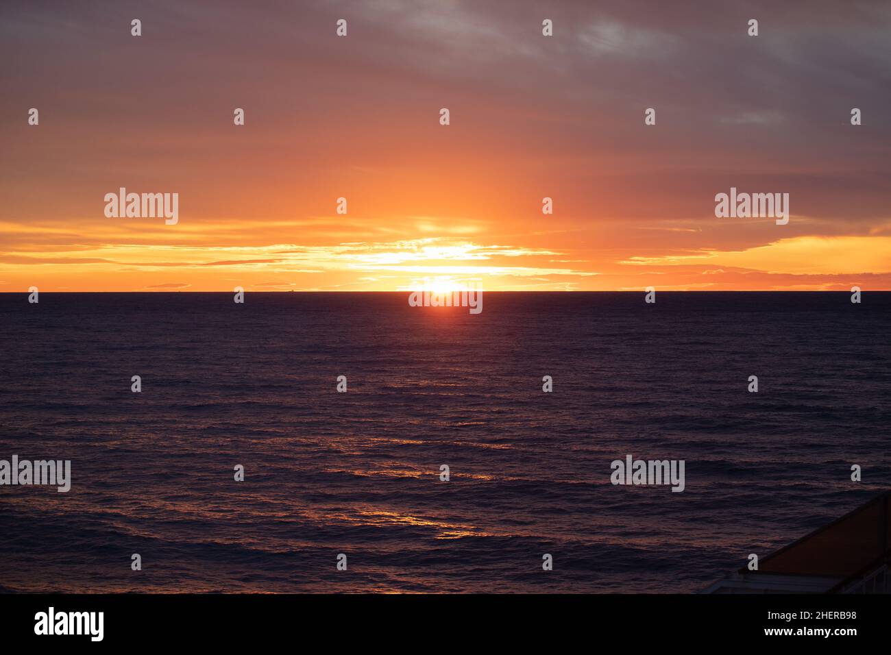 Sunset during a boat trip in the middle of the sea Stock Photo - Alamy