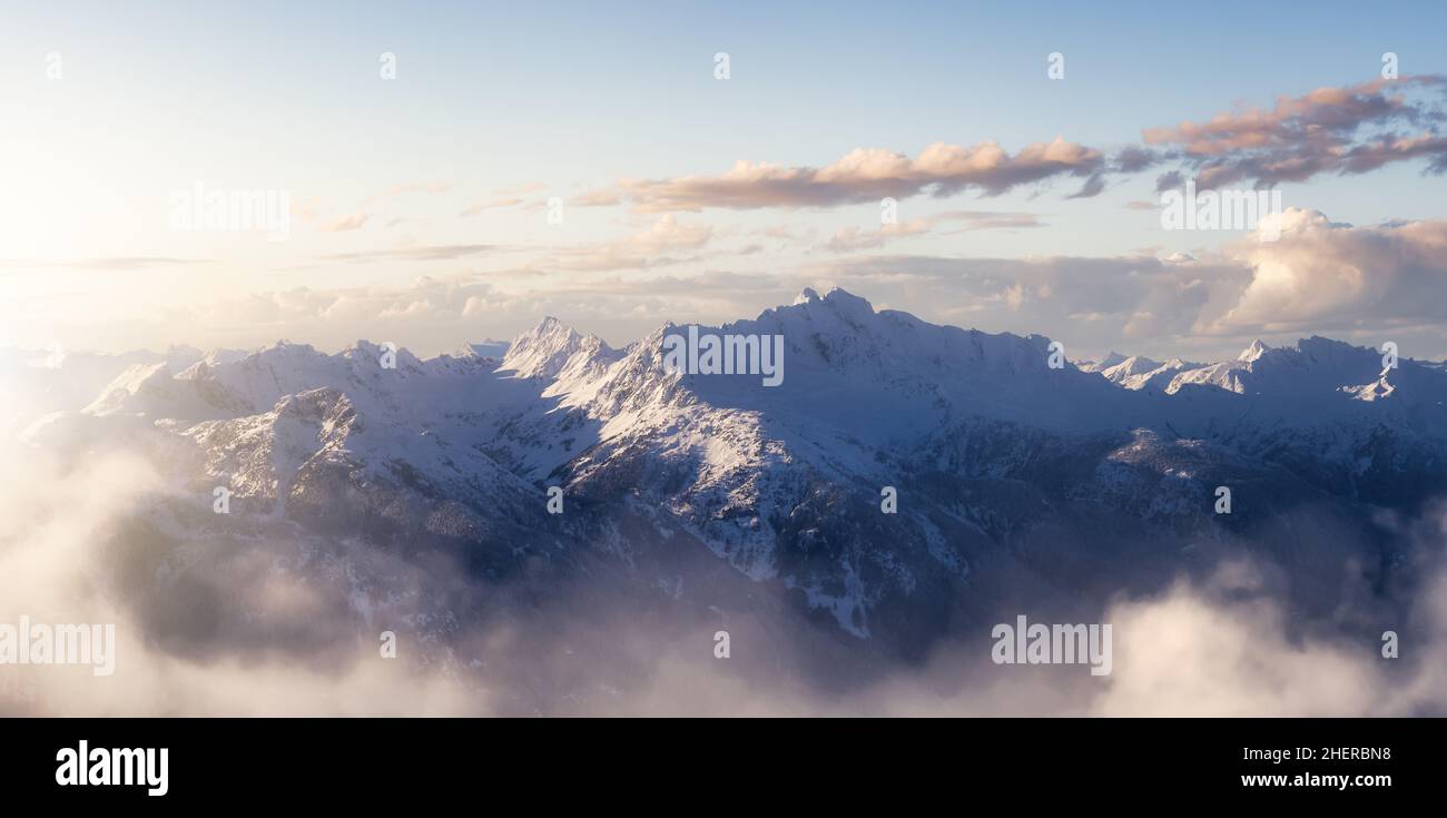 Aerial Panoramic View of Canadian Mountain covered in snow Stock Photo ...