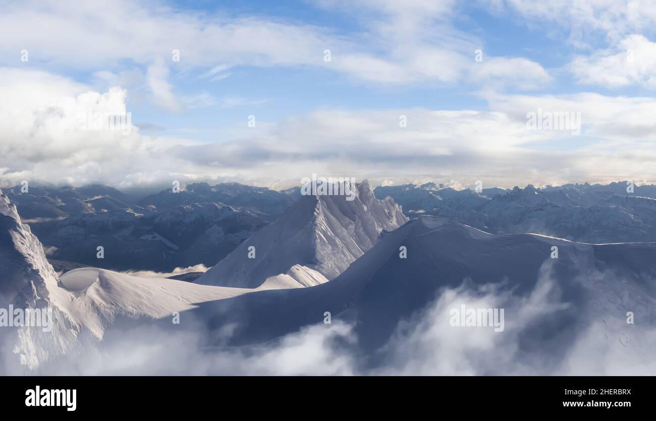 Aerial Panoramic View of Canadian Mountain covered in snow Stock Photo ...