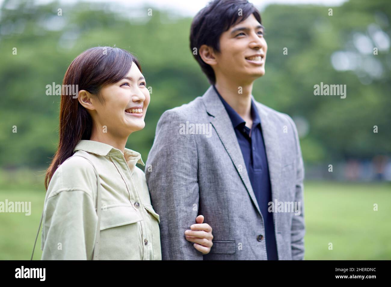 Japanese Couple Taking A Walk In The Park Stock Photo - Alamy