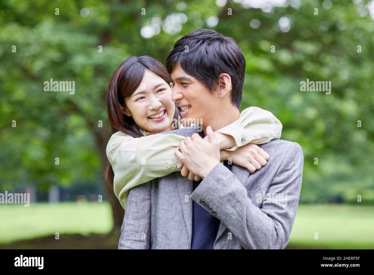 Cuddling Japanese Couple Stock Photo - Alamy