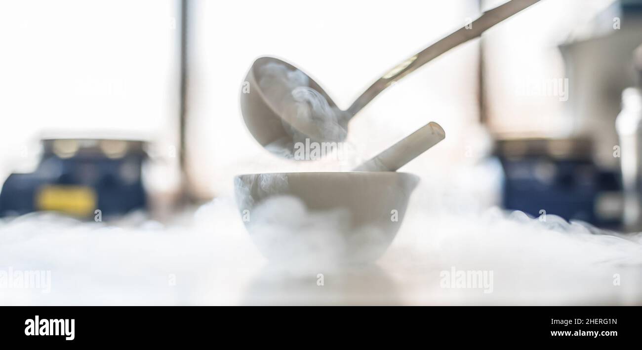 Laboratory experiment with liquid nitrogen in laboratory mortar with ...