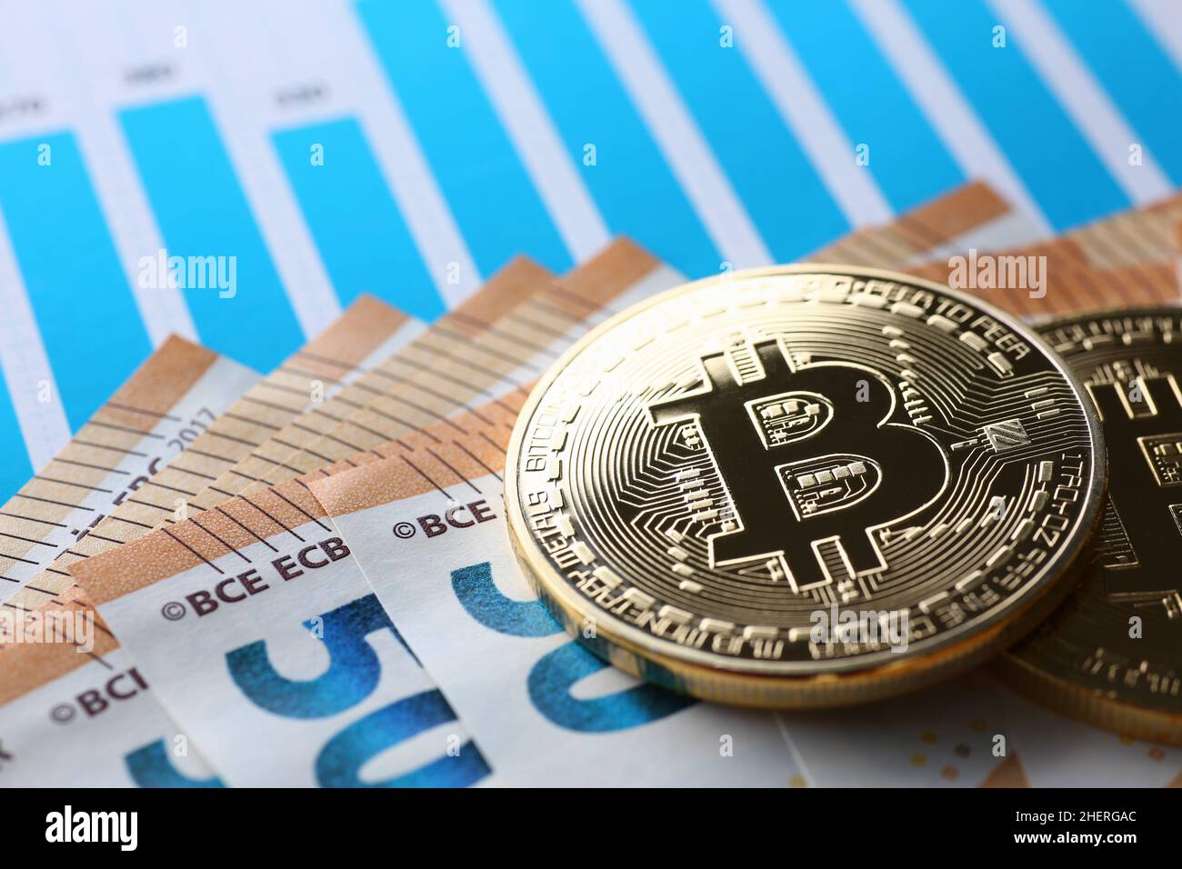 Bitcoin coin diagram and cash on table Stock Photo - Alamy