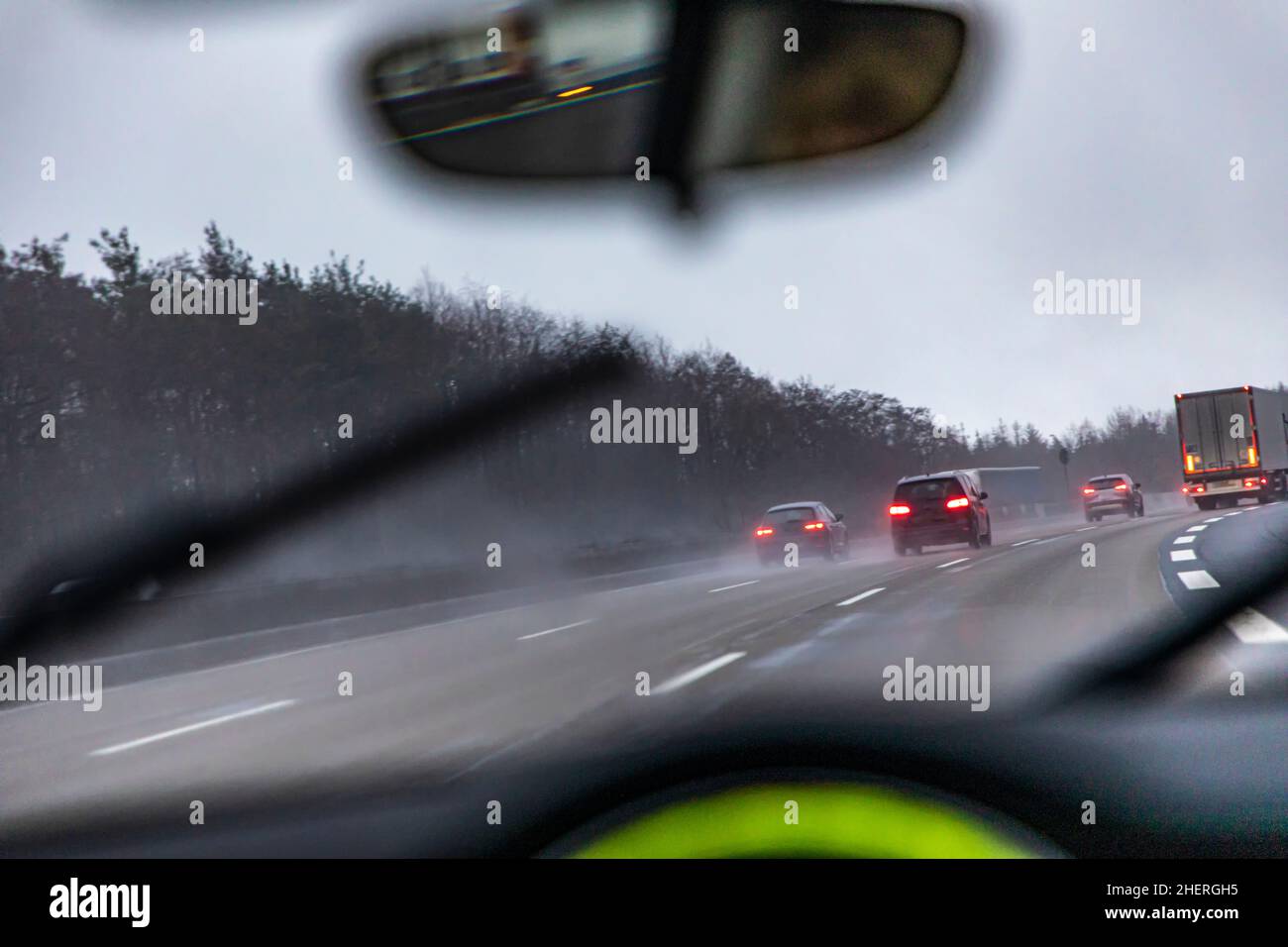 driving on a german highway with bad view due to rain Stock Photo - Alamy