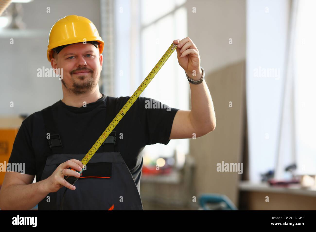 Holds tape measure hi-res stock photography and images - Alamy