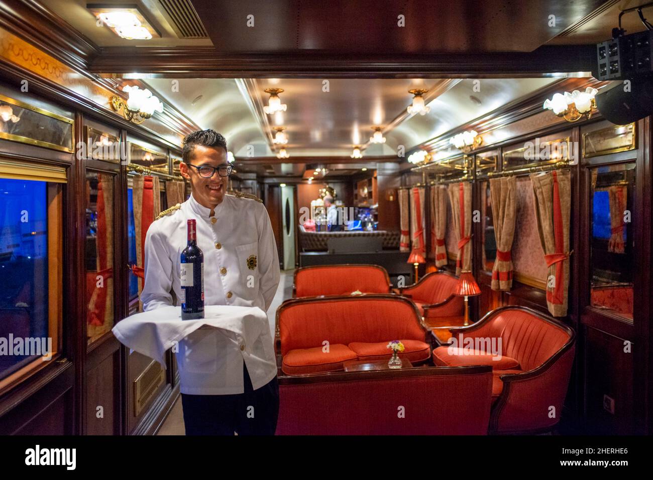 Waiter in the saloon wagon of Al-Andalus luxury train travelling around ...
