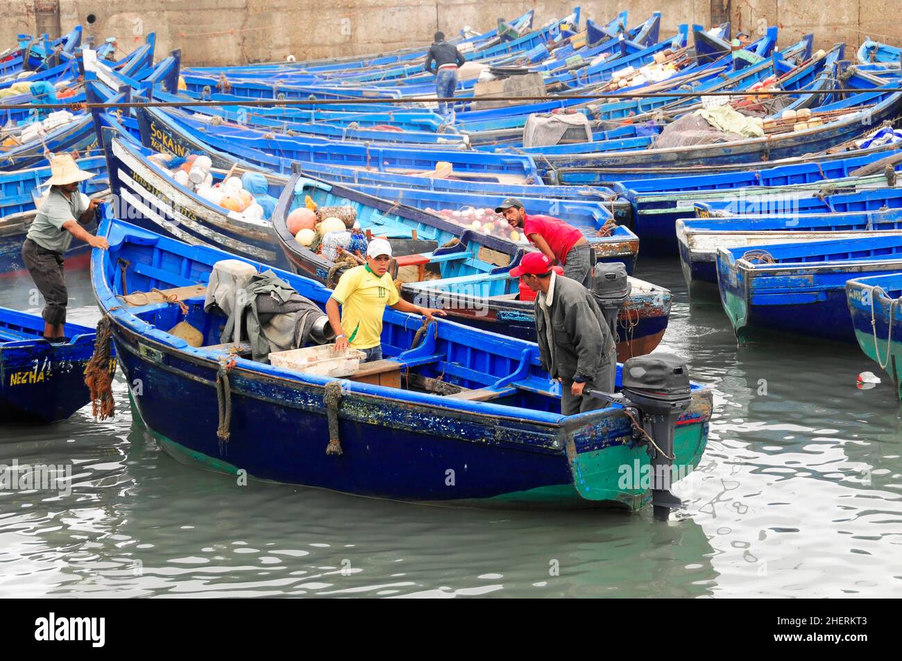 Typical blue fishing boats in the harbour of Essaouira, Morocco Stock ...