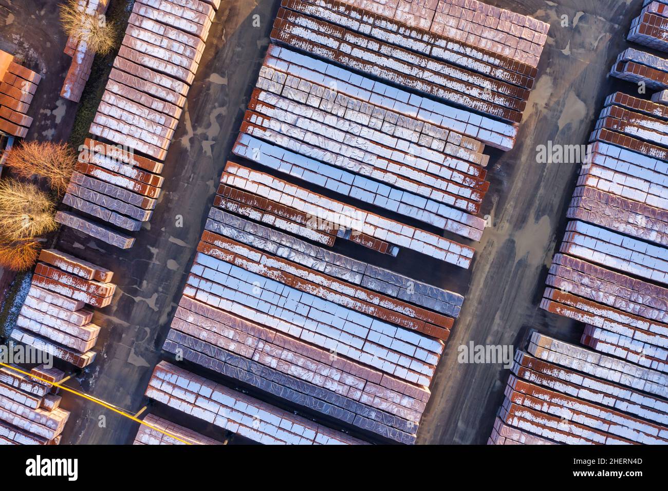 Stacks of bricks in a yard of brick factory. Piles of bricks stacked ...