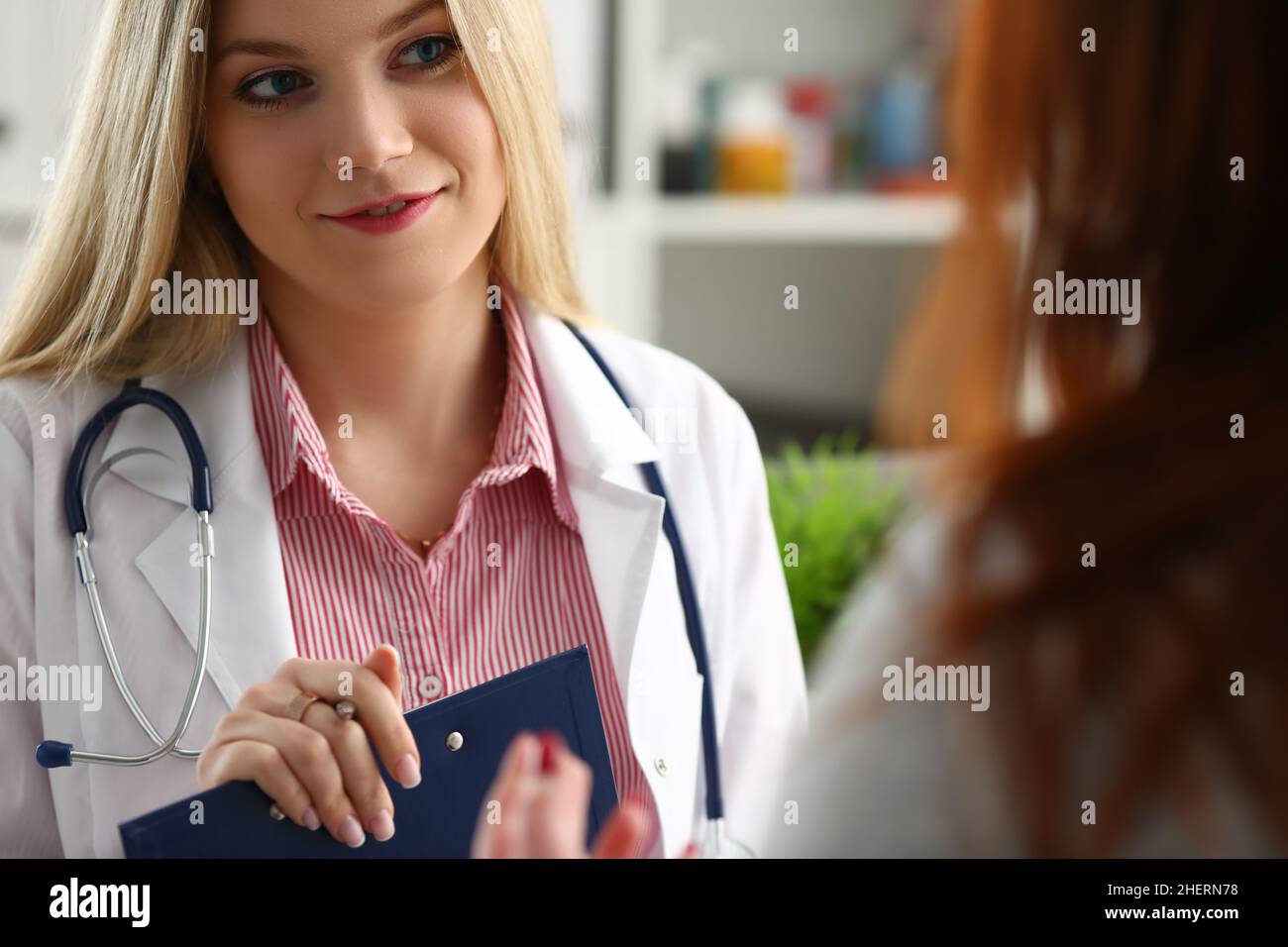 Female doctor explains diagnosis to patient closeup Stock Photo - Alamy