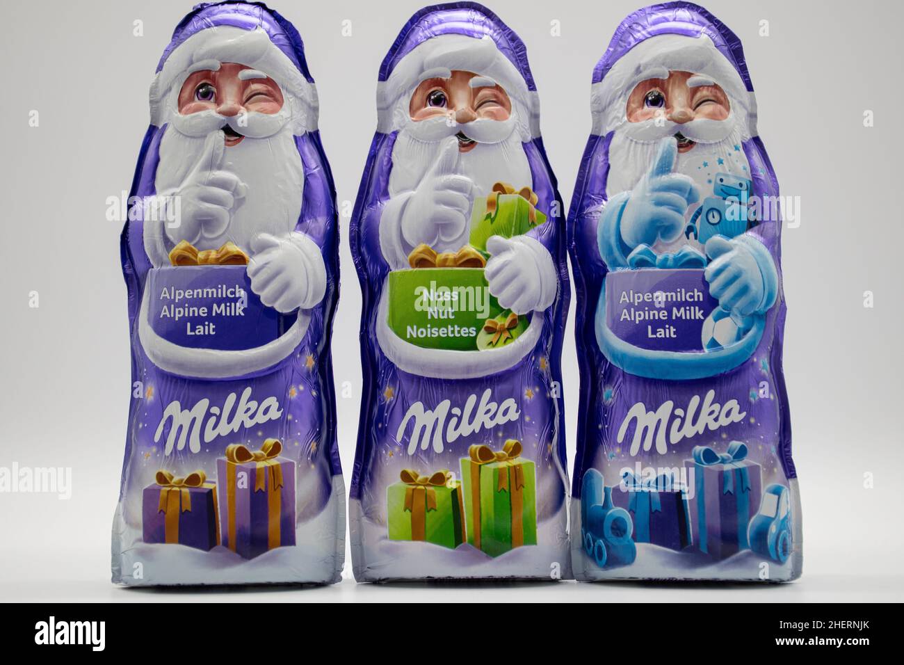RHEINBACH, GERMANY 08 December 2020, Three purple Milka Santa Clauses ...